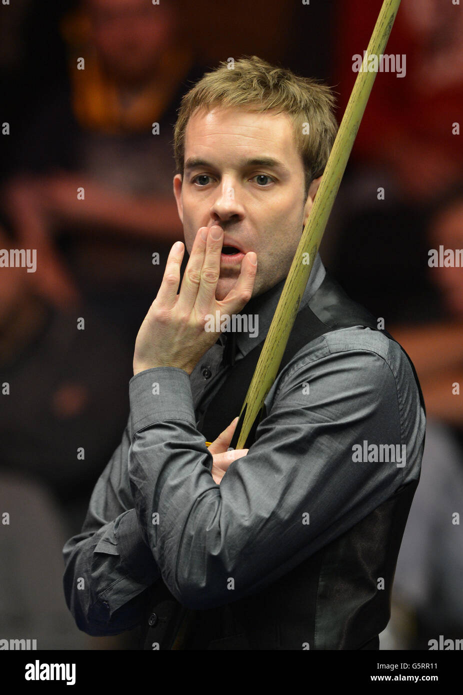 Allister Carter in action against John Higgins during day two of the ...