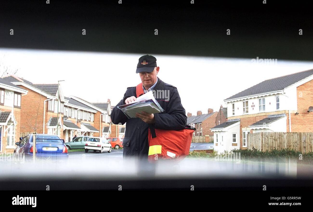 A postman delivers the morning mail in Newcastle on the day that ...
