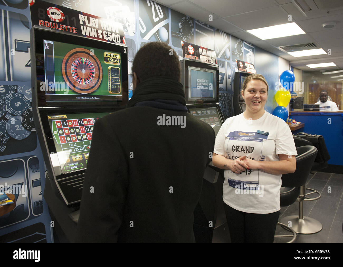 A punter tries out a new gambling machine during the opening of new ...
