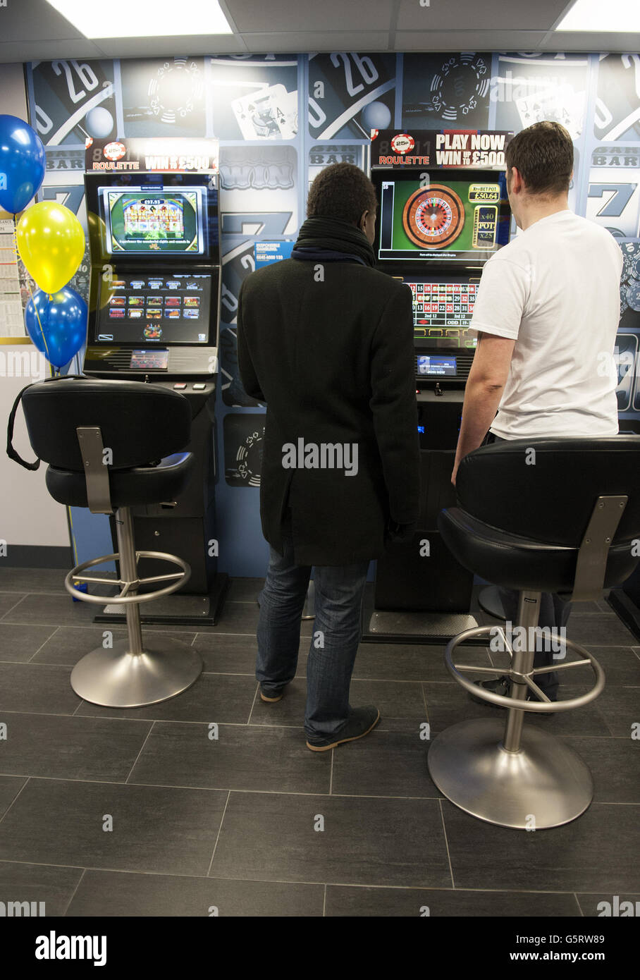 A punter tries out a new gambling machine during the opening of new ...