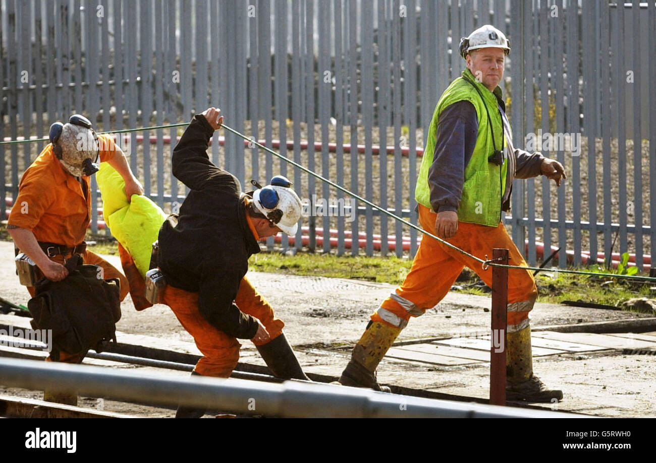 Miners walk through the Longannet deep mine in Fife, after it was ...
