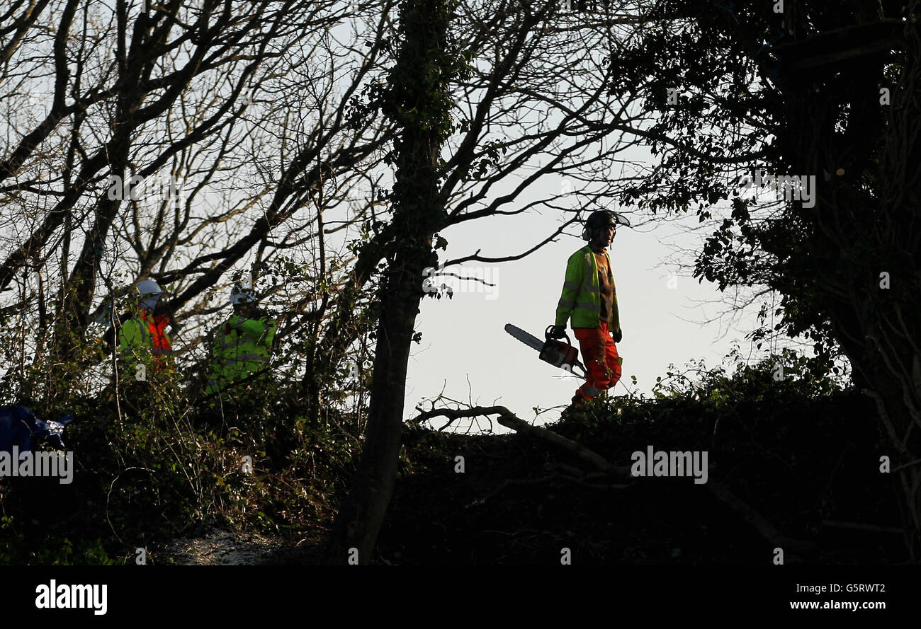 Workmen clear the area of the Combe Haven Defenders base camp near ...