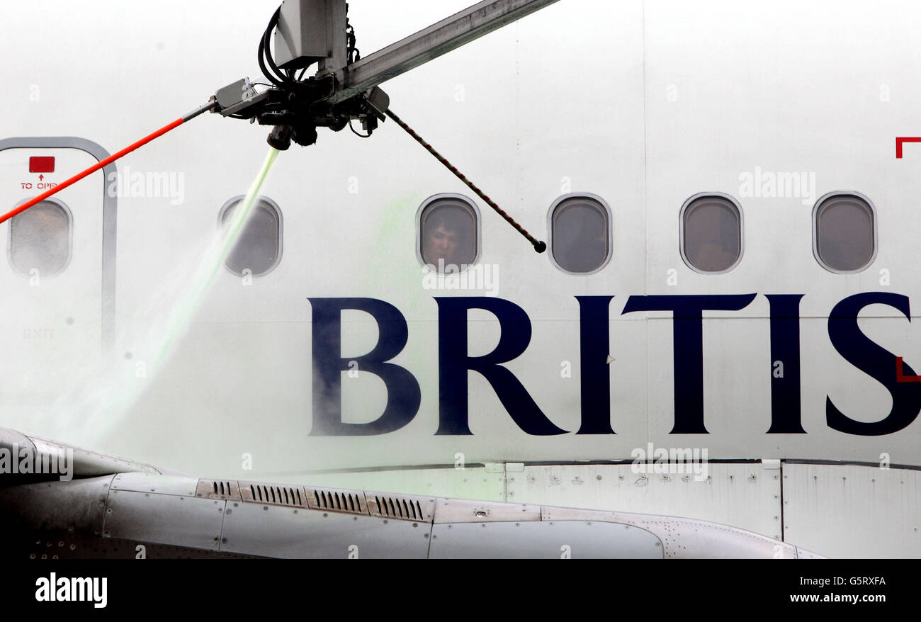 A British Airways plane is de-iced at Heathrow Airport Stock Photo - Alamy