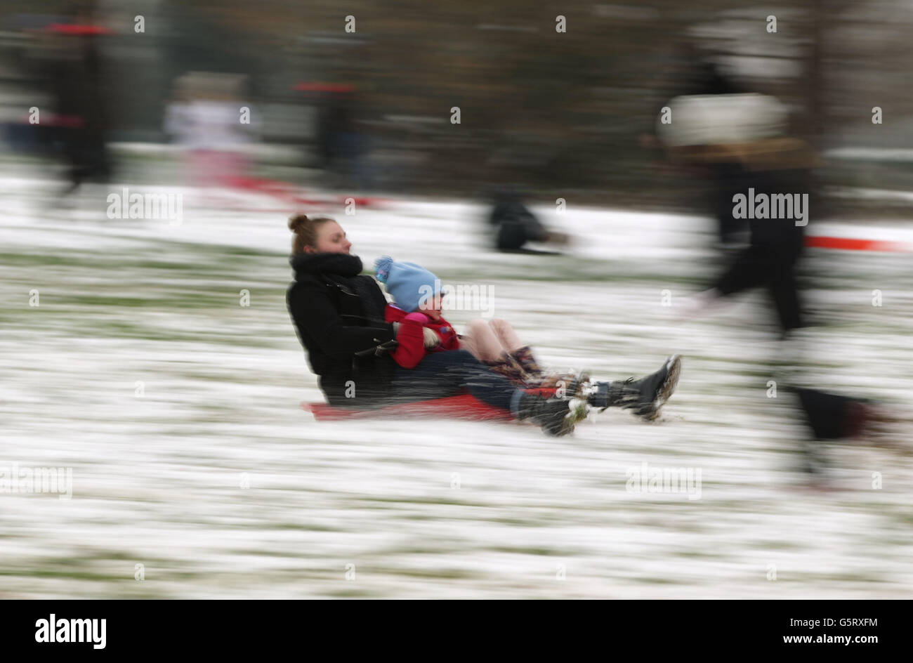 People sledging in the snow at Alexandra Palace in north London Stock ...