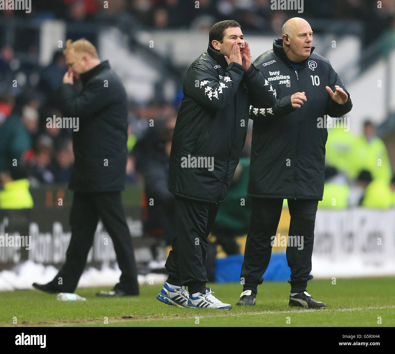 Derby's manager Nigel Clough (centre) shouts instructions to his team ...