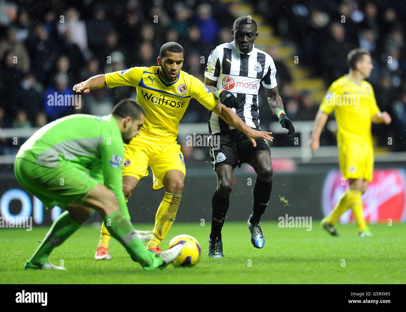 Reading's goalkeeper Adam Federici claims the ball ahead team-mate ...