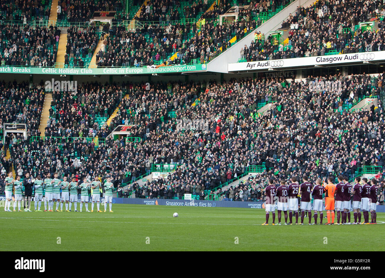 Celtic and Hearts players join in a minutes applause in memory of ...