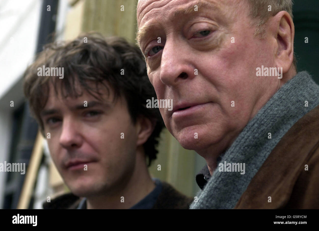 Actors Michael Caine (right) and Dylan Moran take a break from filming ...