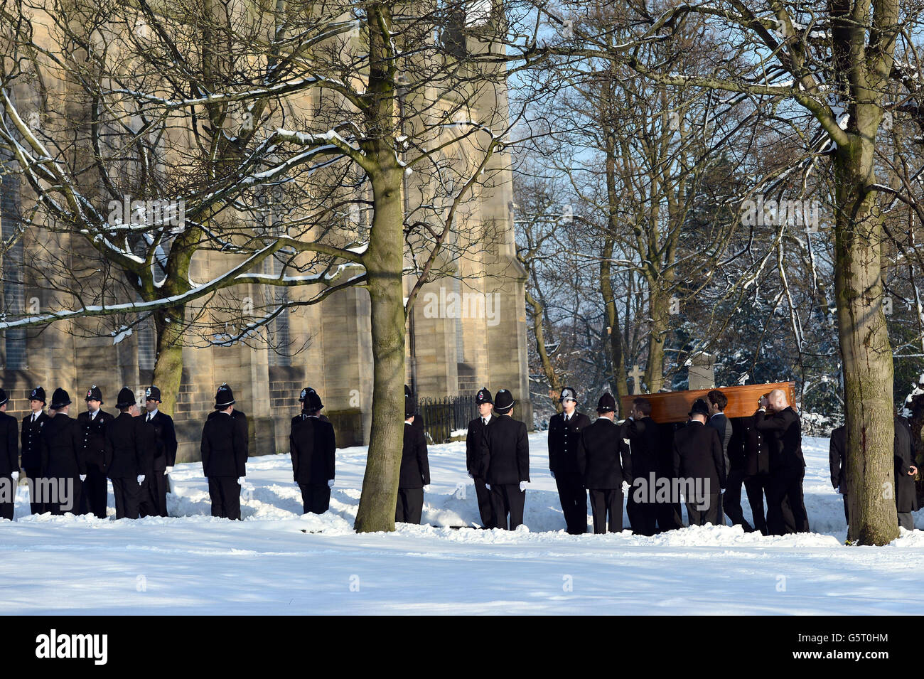 Police officers form a guard of honour at Pudsey Parish Church near ...