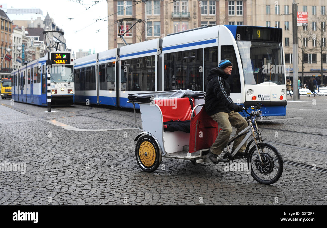 A man on a tricycle in the streets of amsterdam hi-res stock ...