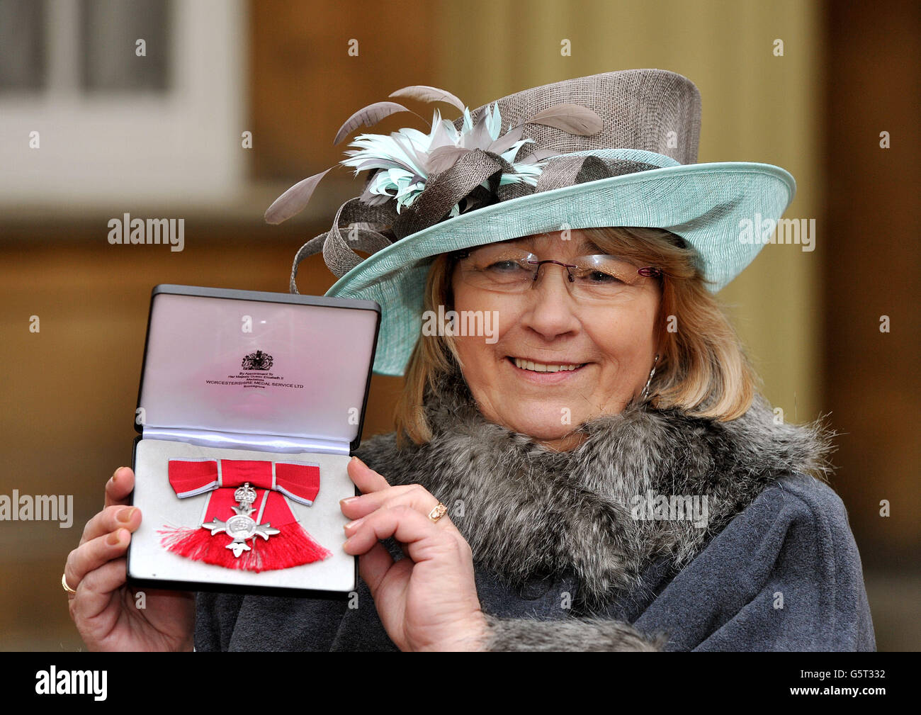 Christine Kerr proudly holds her his Member of the British Empire (MBE ...