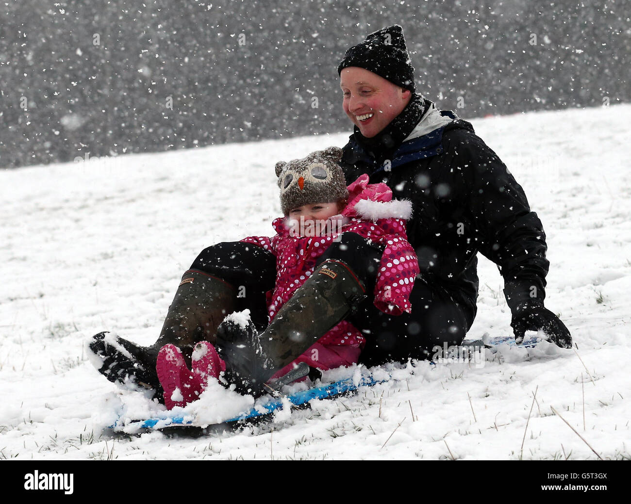 Davie Booth and three year-old daughter Freya sledging in Doune ...