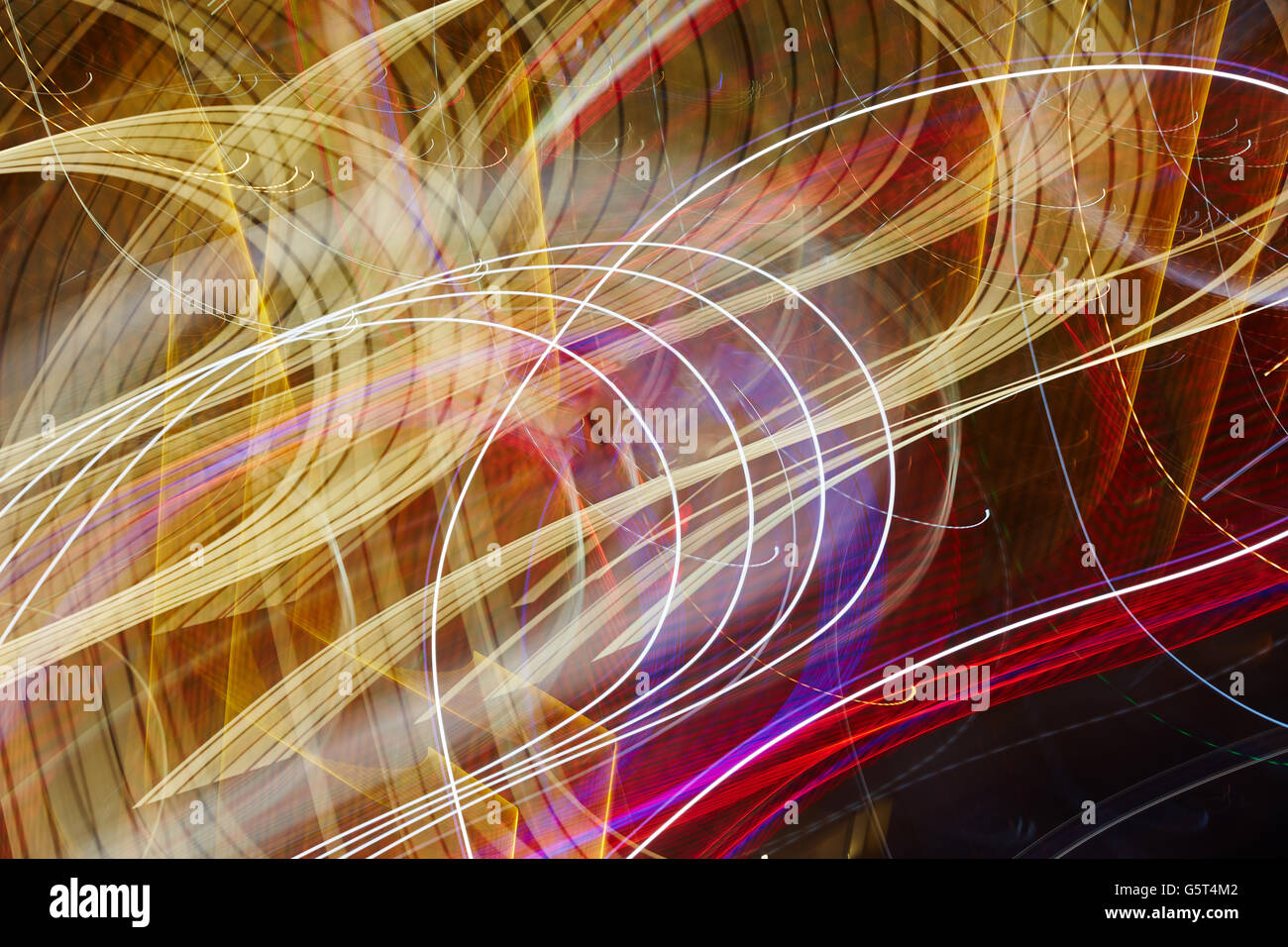 Abstract colorful light trails background at night Stock Photo - Alamy