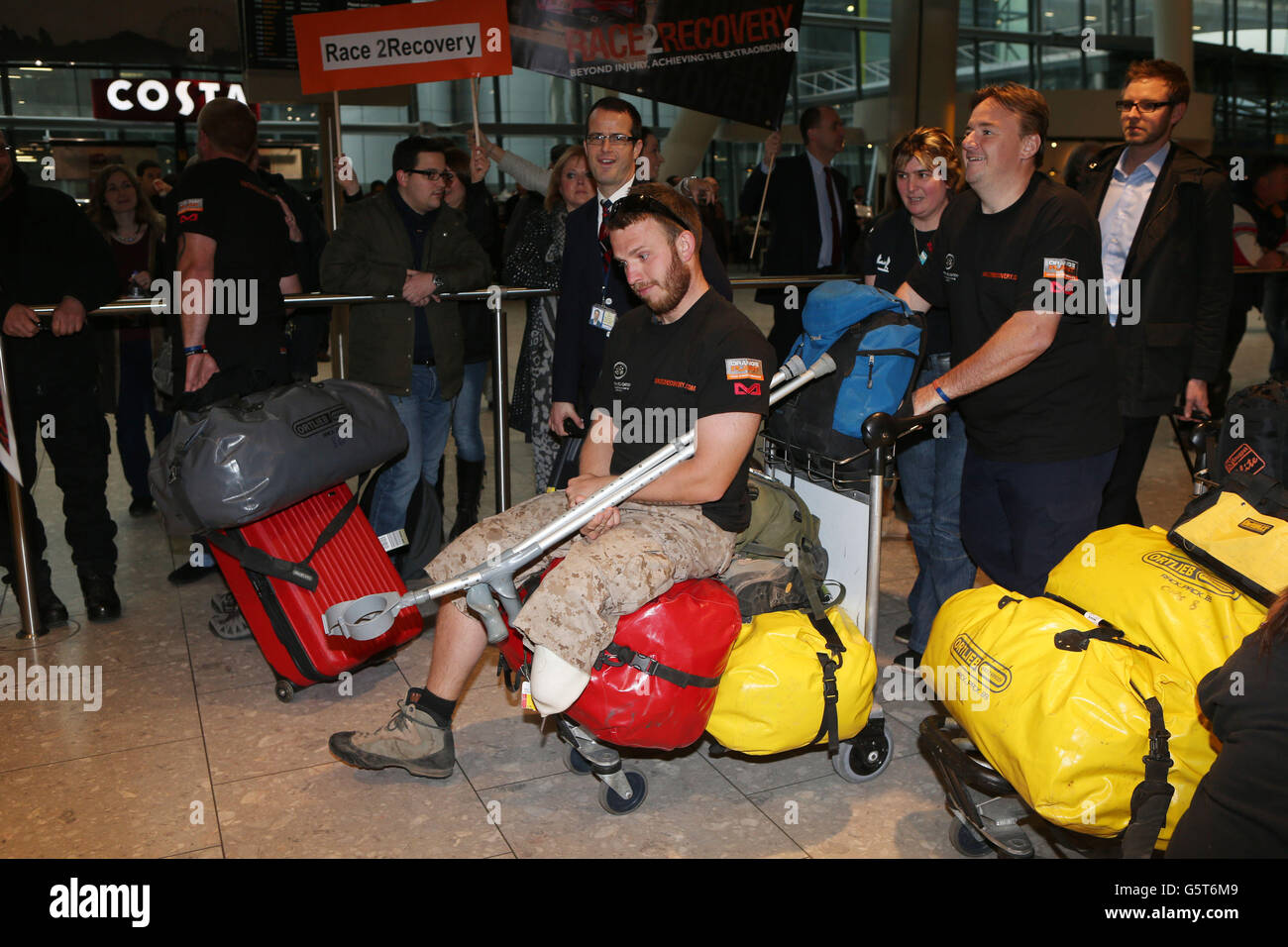 The Race2Recovery team as they return to Terminal 5 at Heathrow Airport ...