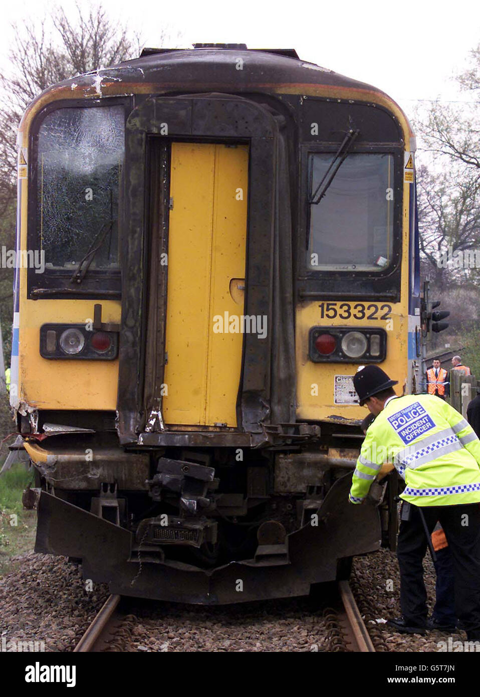 A British Transport Police officer inspect the damage to a train that ...