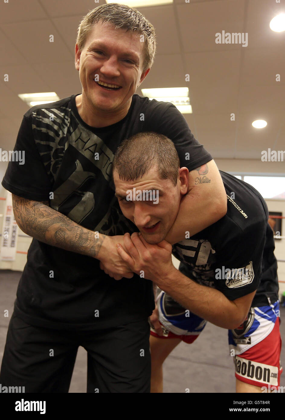 Former boxer Ricky Hatton (left) and British UFC fighter Paul Sass pose ...