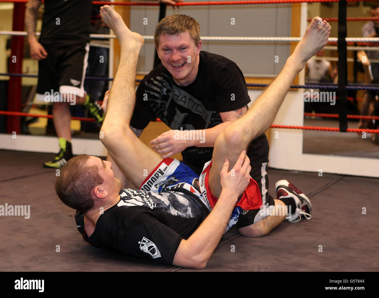 Former boxer Ricky Hatton (right) laughs as he is released from a move ...