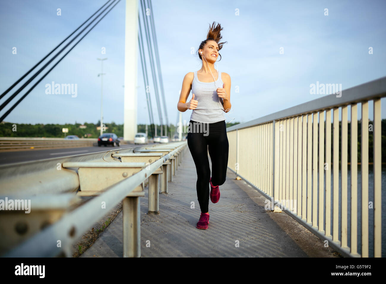 Beautiful woman jogging to stay fit Stock Photo - Alamy