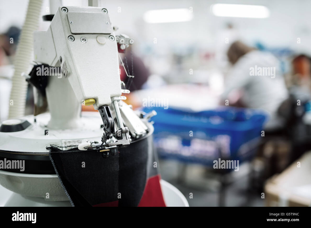 Linking machine in textile industry Stock Photo - Alamy