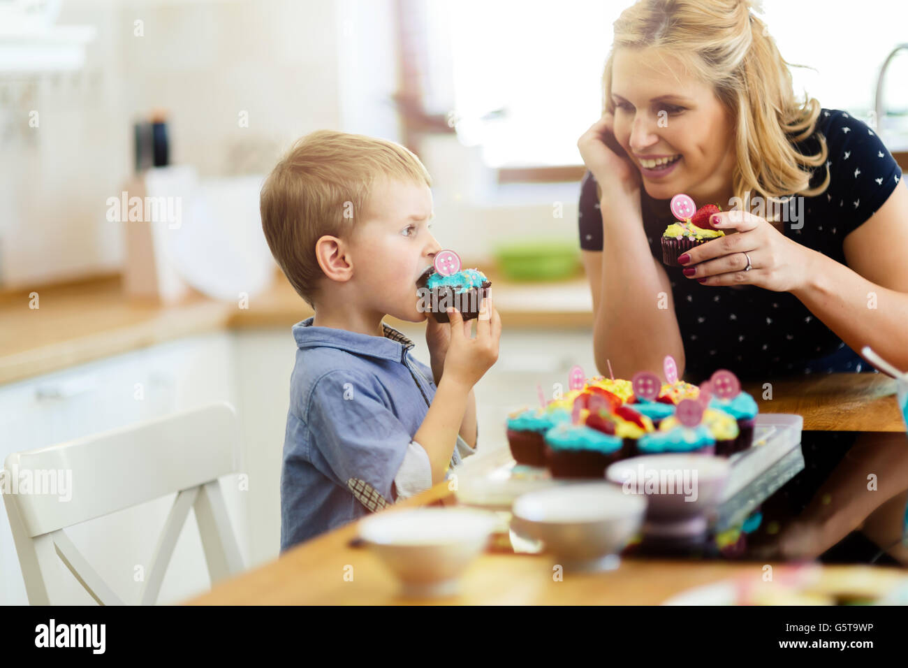 Cute child tasting cookies in kitchen Stock Photo - Alamy