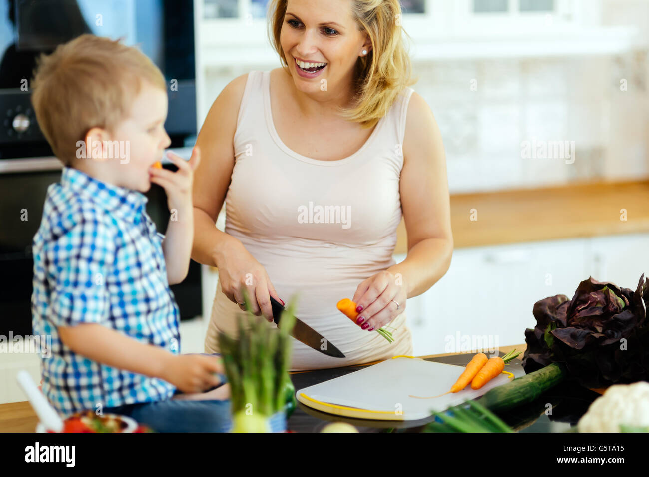 Mother and child preparing lunch from fresh veggies Stock Photo - Alamy
