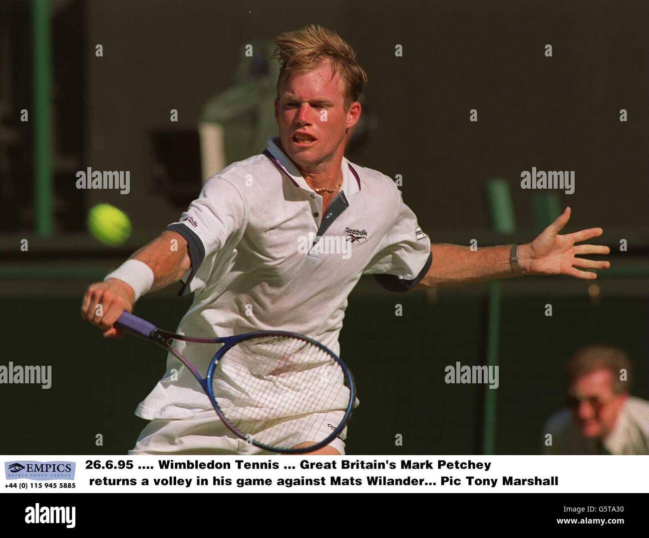 26.6.95. Wimbledon Tennis. Great Britain's Mark Petchey returns a ...