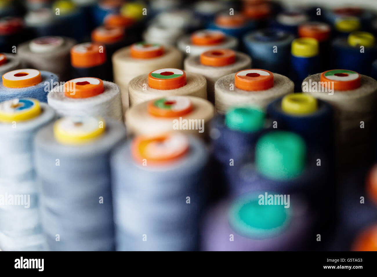 Colorful thread spools used in fabric and textile industry Stock Photo ...