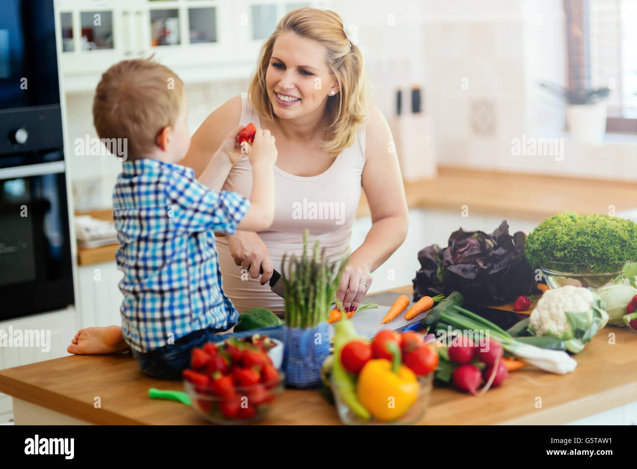 Mother and child preparing lunch from fresh veggies Stock Photo - Alamy