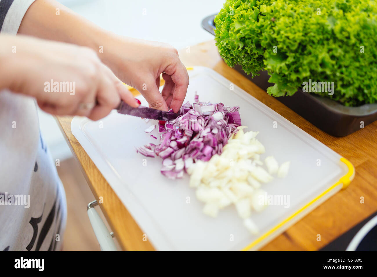 Woman cooking kitchen red top hi-res stock photography and images - Alamy