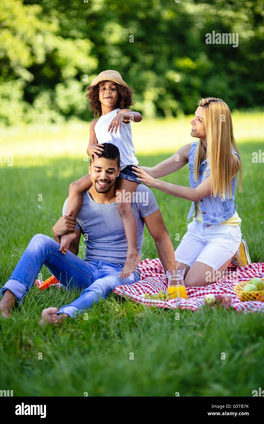 Daughter playing with strong daddy Stock Photo - Alamy