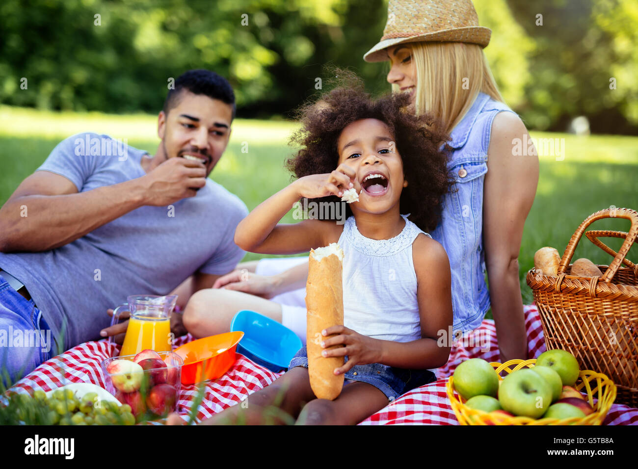 Family enjoying picnicking in nature Stock Photo - Alamy