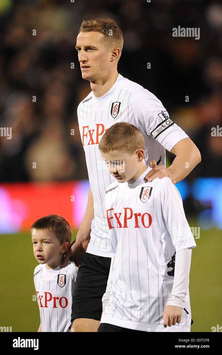 Fulham captain Brede Hangeland walks out onto the pitch with the ...