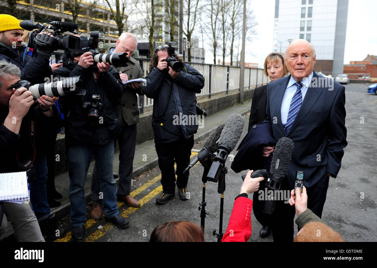 Former TV presenter Stuart Hall reads a statement outside Preston ...