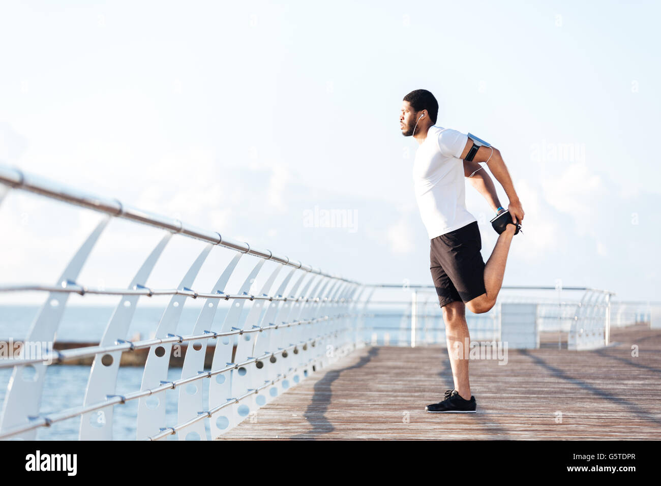Full length of attractive african american sportsman standing and ...