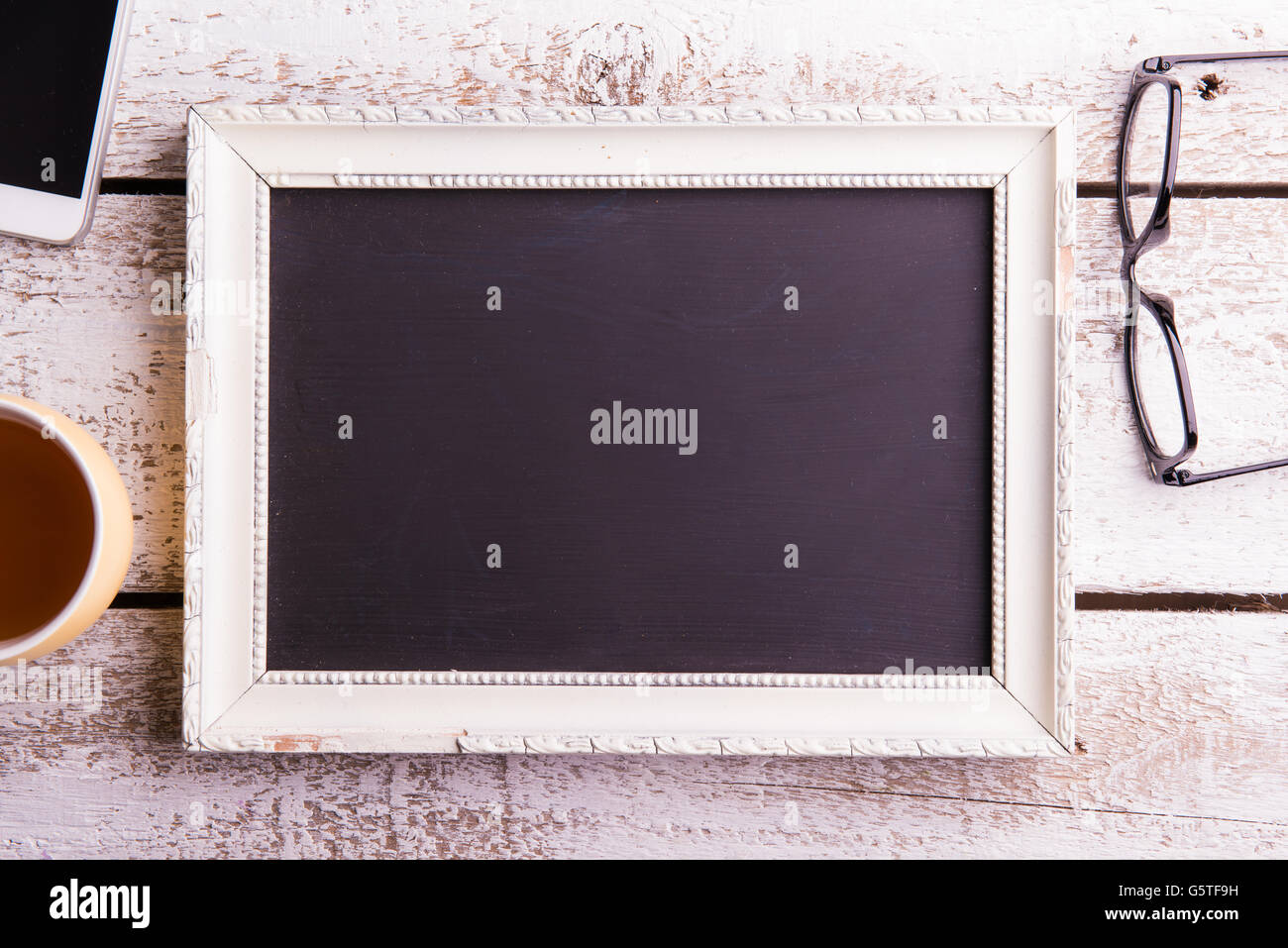 Empty picture frame, eyeglasses, cup of coffee and smartphone Stock ...