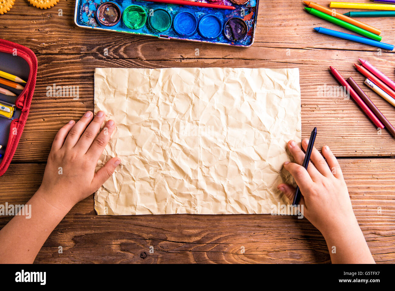 Unrecognizable girl drawing on empty sheet of paper Stock Photo - Alamy