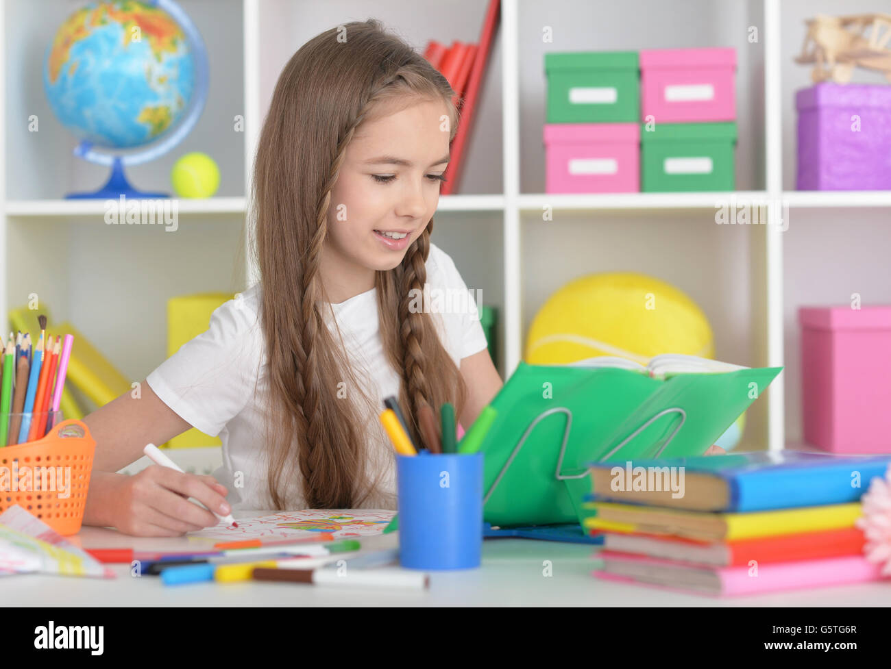 Portrait of a cute student girl at class Stock Photo - Alamy