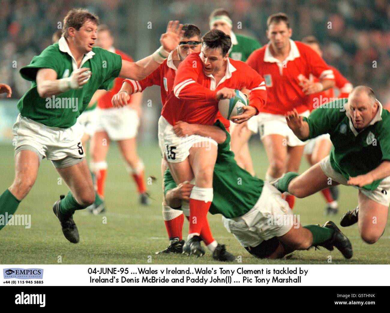 Wale's Tony Clement is tackled by Ireland's Denis McBride and Paddy ...