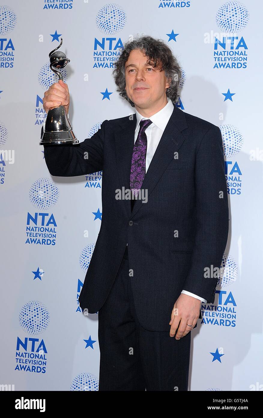 Alan Davies poses with the Comedy Panel Award for 'QI' in the press ...