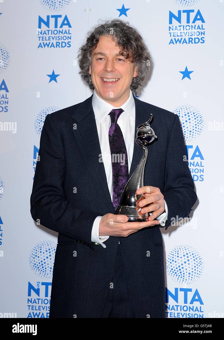 Alan Davies poses with the Comedy Panel Award for 'QI' in the press ...