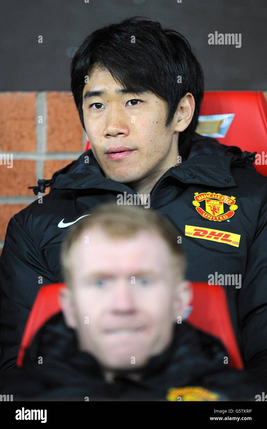 Manchester United's Shinji Kagawa sat on the United bench Stock Photo ...