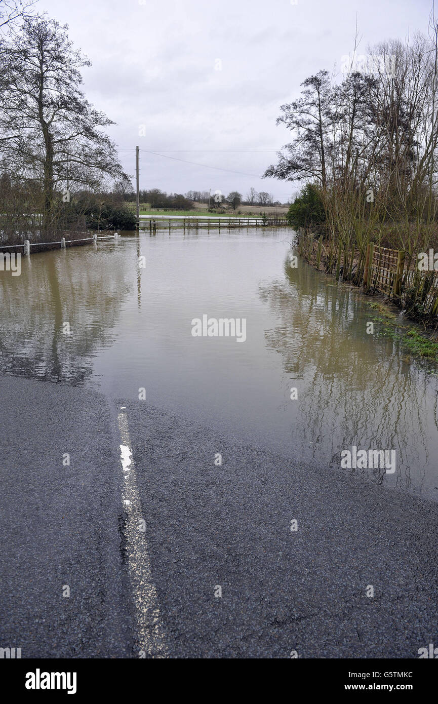 The River Chelmer, floods the roadway at Paper Mill Lock, Little Baddow ...