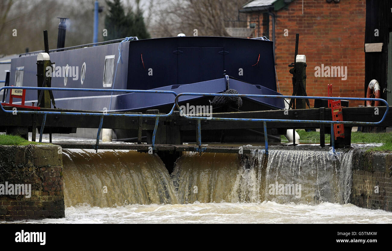 Flood water from recent snow melt bursts over the lock gates of the ...