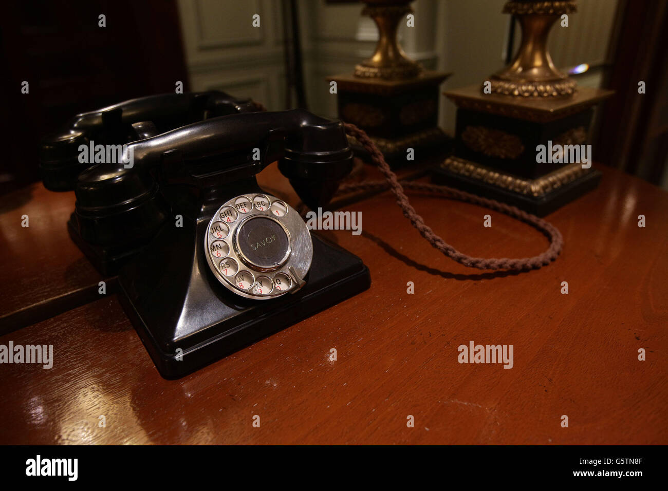 A telephone on a desk in a corridor in the Savoy Hotel, in central ...