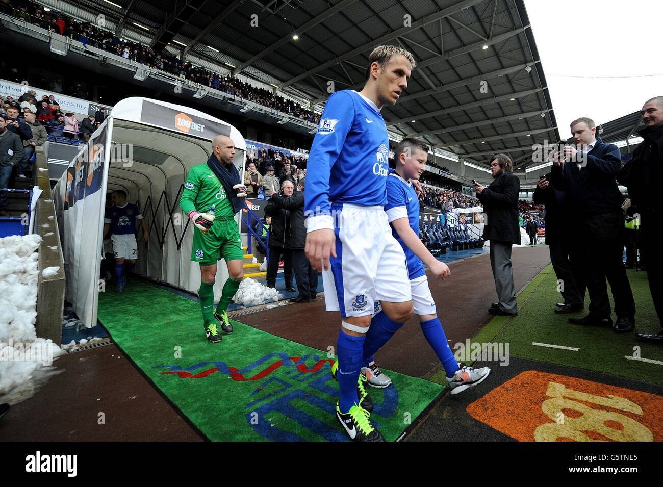 Everton's Phil Neville (right) and goalkeeper Tim Howard (left) walk ...