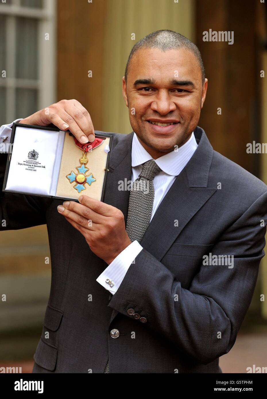 Paul Elliott proudly holds his Commander of the British Empire (CBE ...