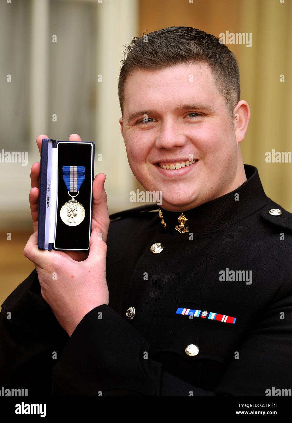 Sapper Matthew Garey of the Royal Engineers proudly holds his Queen's ...