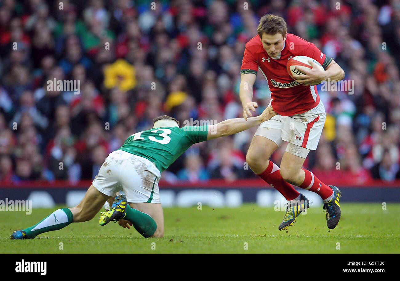 Wales' Dan Biggar sidesteps the tackle of Ireland's Brian O'Driscoll ...