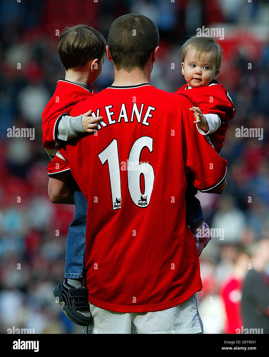 Manchester United's Roy Keane on the pitch with his children after the ...