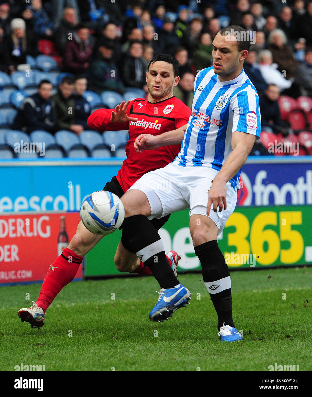 Cardiff City's Craig Conway (left) and Huddersfield Town's Joel Lynch ...